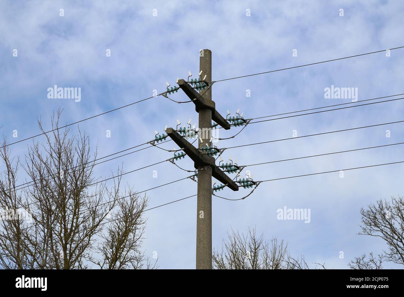 Power pylon on a blue sky background Stock Photo - Alamy