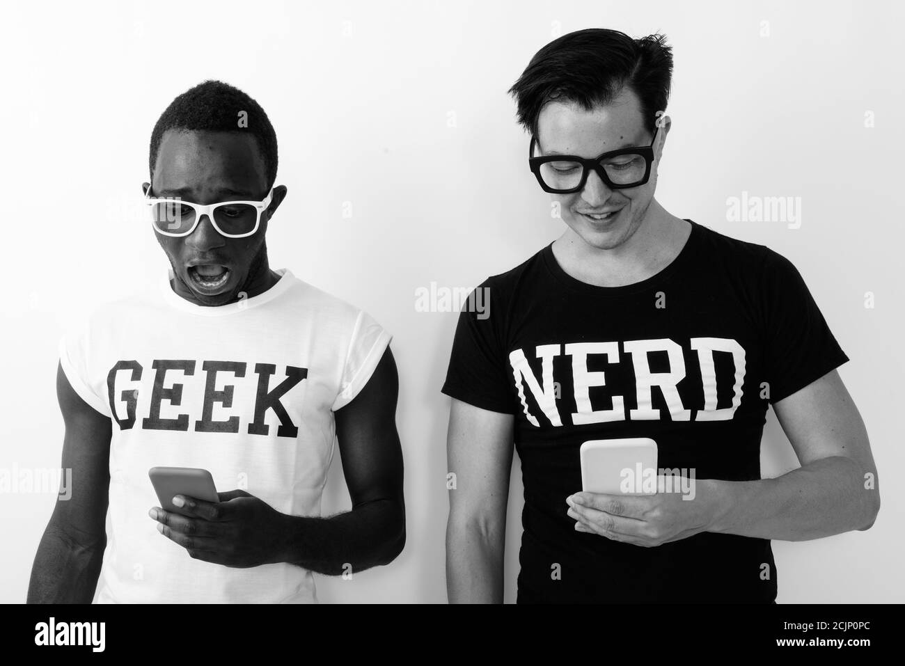 Shocked young African Geek man using mobile phone while happy European ...