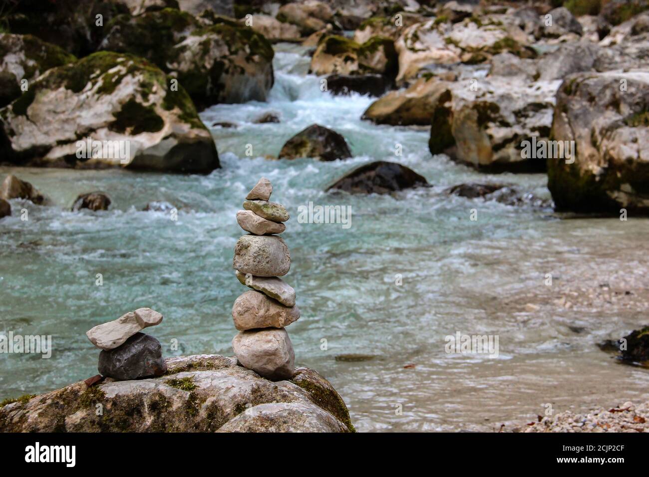 Stack of stones at riverbank Stock Photo - Alamy