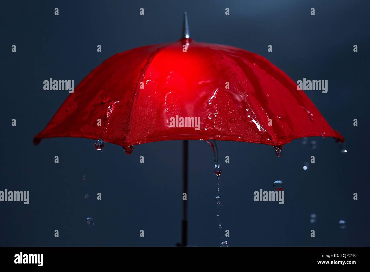 Rain drops falling from red umbrella. Bad weather concept Stock Photo ...