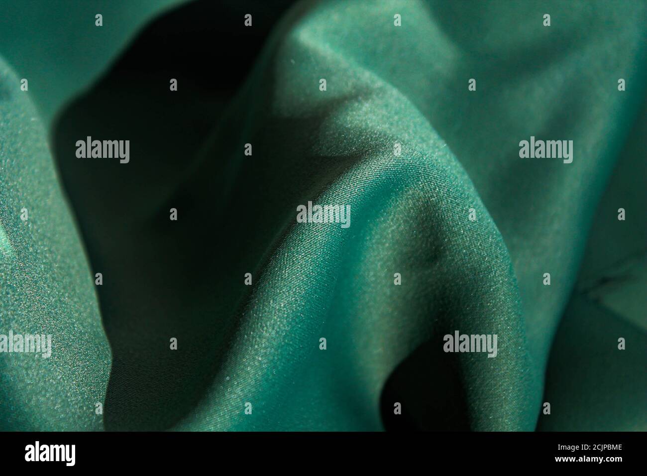 The texture of the green fabric is wrinkled Stock Photo - Alamy