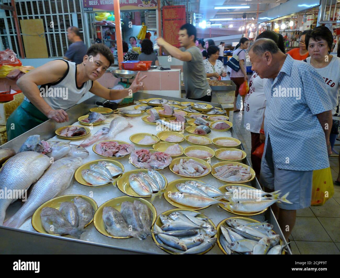 PEOPLE INSIDE THE FISH MARKET Stock Photo - Alamy