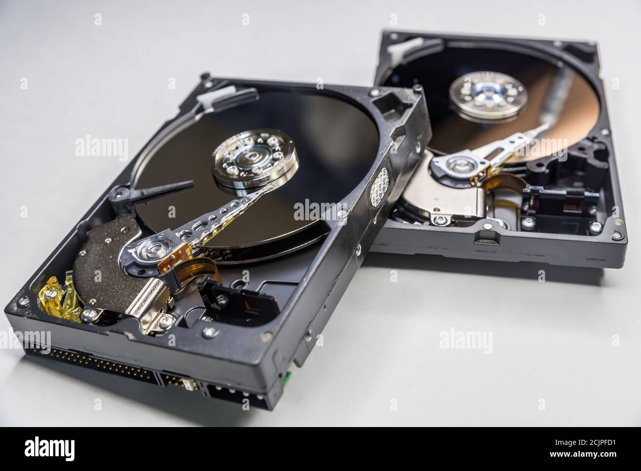 Old-fashioned, open, mechanical harddisc drives, isolated on a white ...