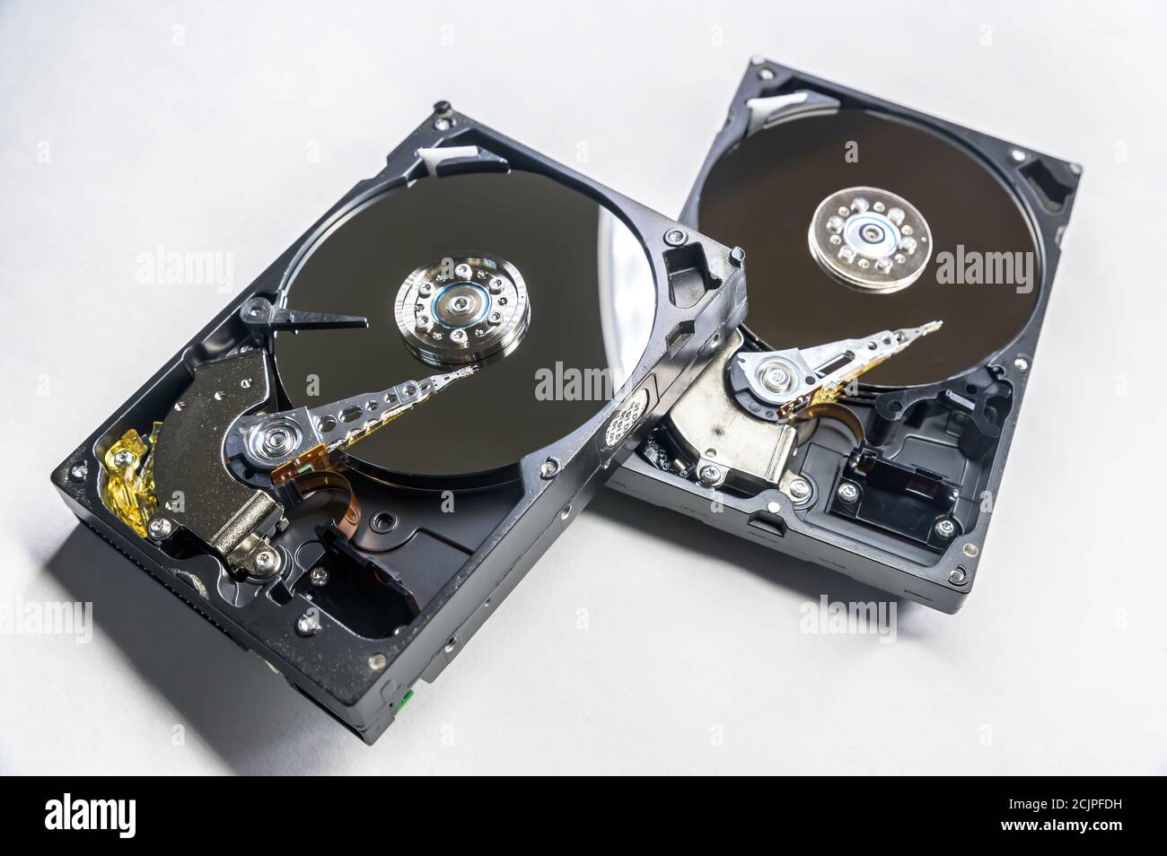 Old-fashioned, open, mechanical harddisc drives, isolated on a white ...