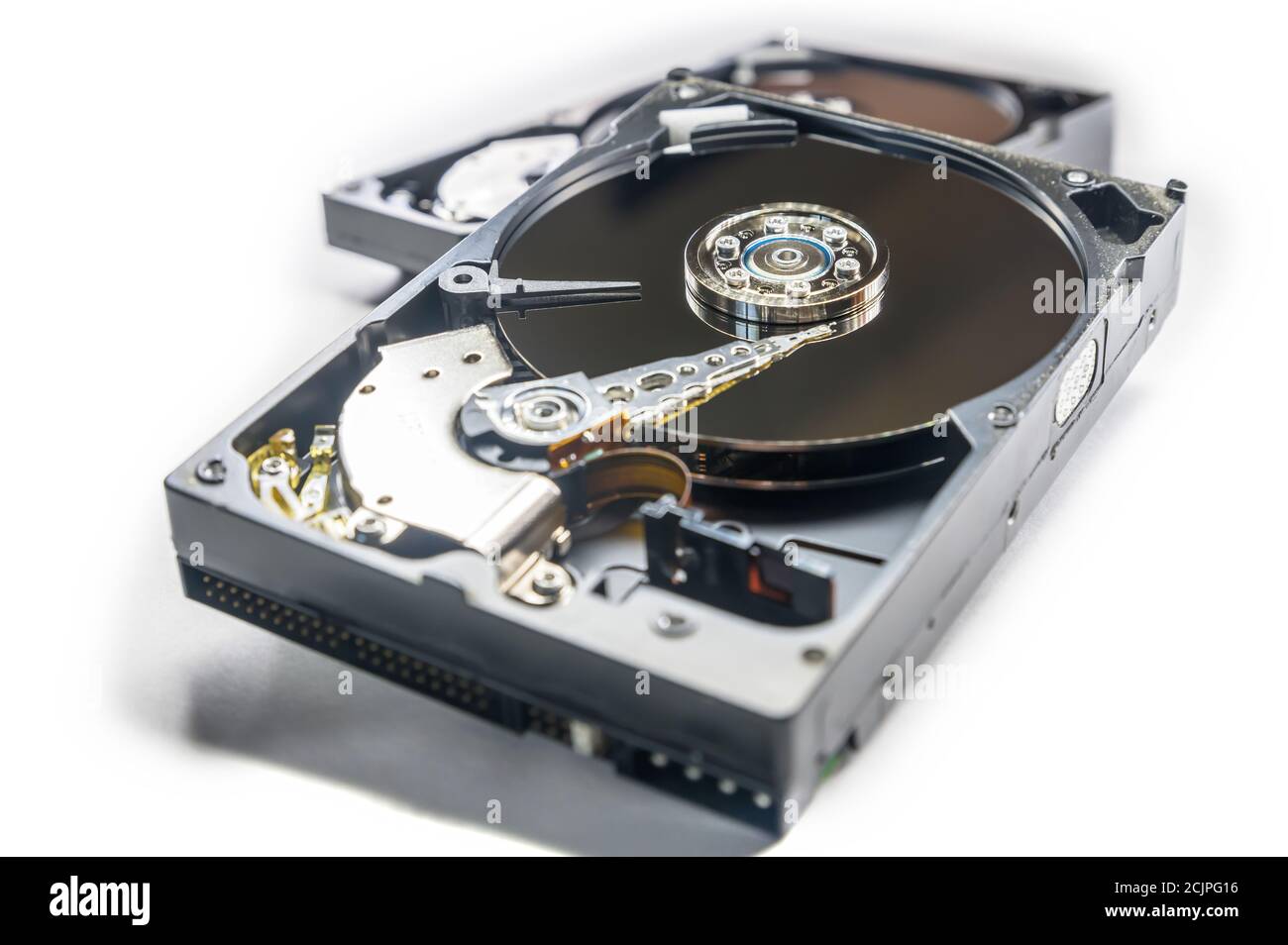 Old-fashioned, open, mechanical harddisc drives, isolated on a white ...