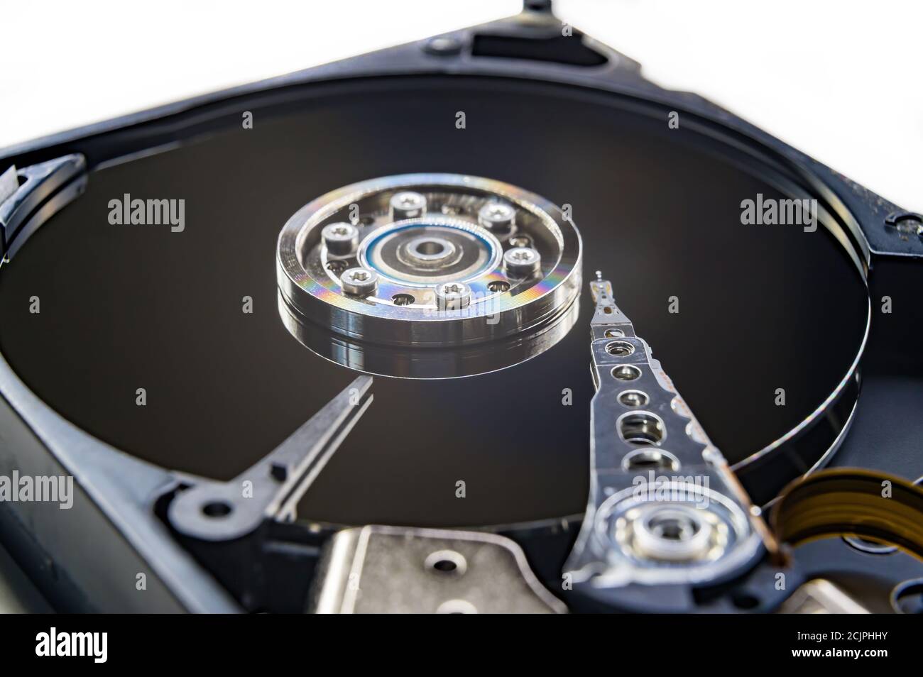 Close-up of an old fashioned, open, mechanical harddisc drive, isolated ...