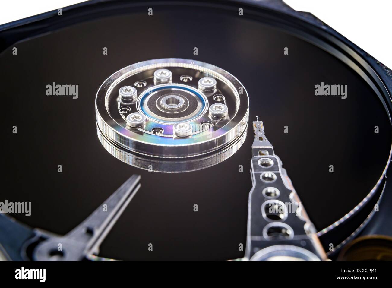 Close-up of an old fashioned, open, mechanical harddisc drive, isolated ...