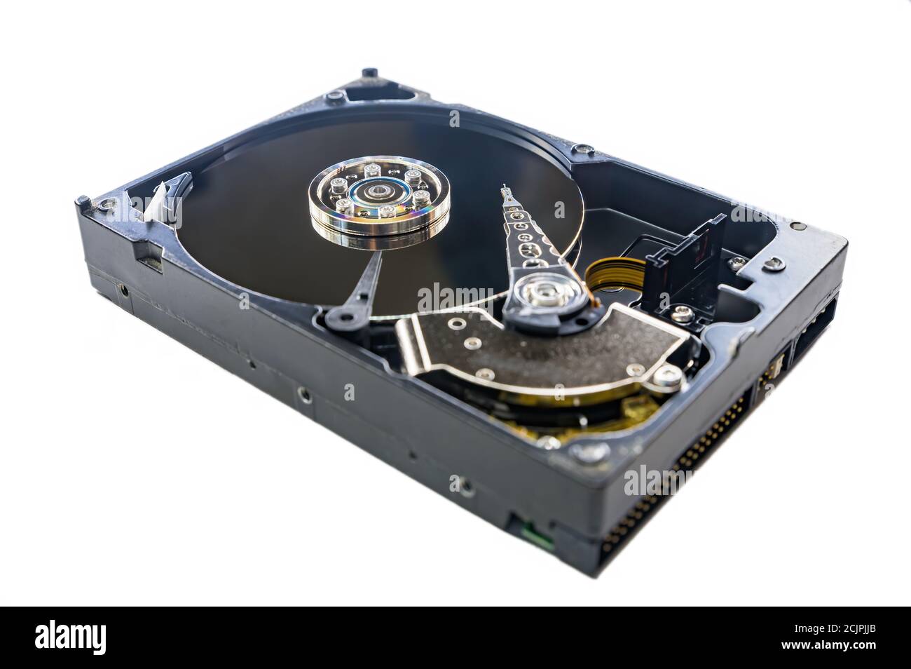 Old-fashioned, open, mechanical harddisc drive, isolated on a white ...
