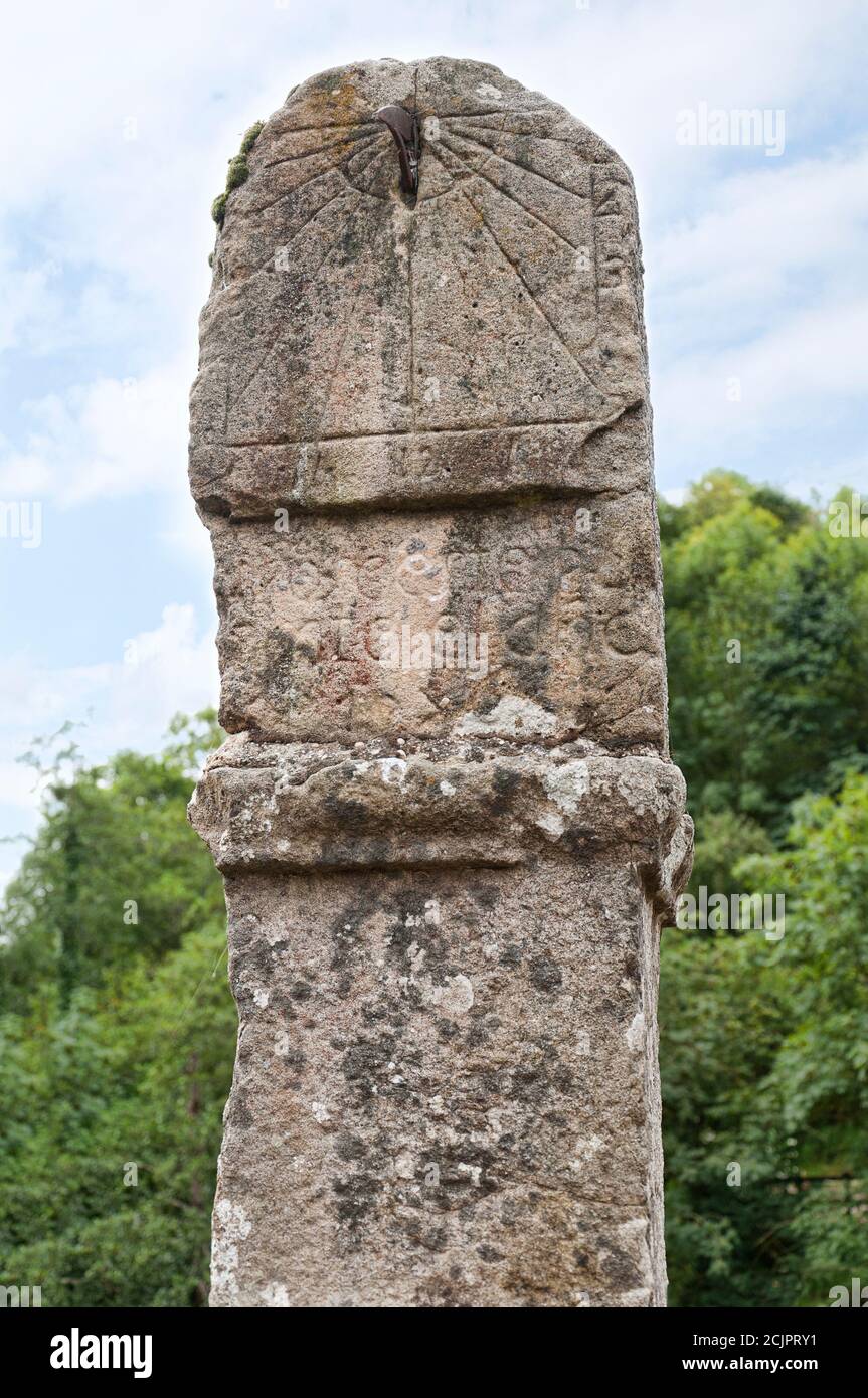 Old stone column with a sundial on top Stock Photo - Alamy