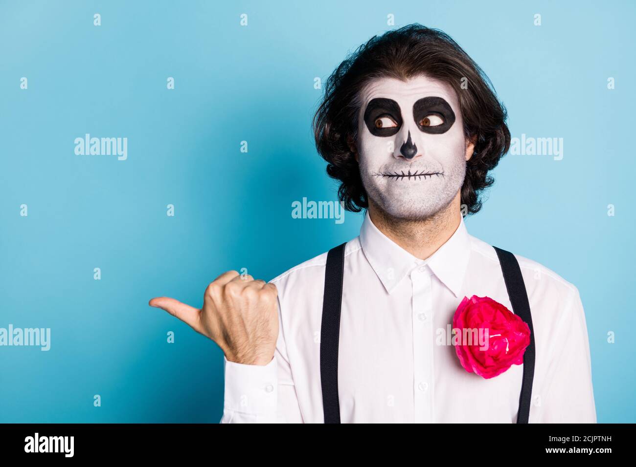 Close-up portrait of his he handsome demonic creepy guy showing copy ...