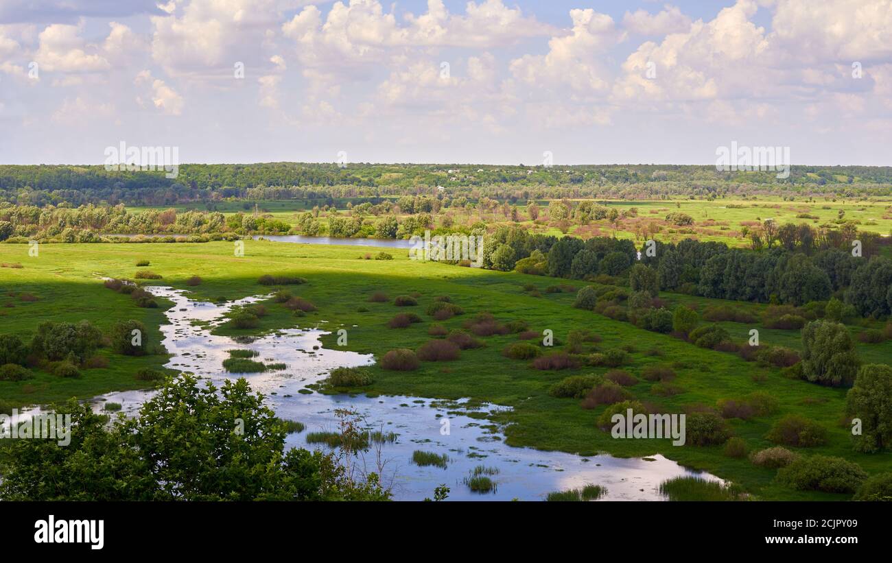 Spill of a small river in the valley at the beginning of summer ...