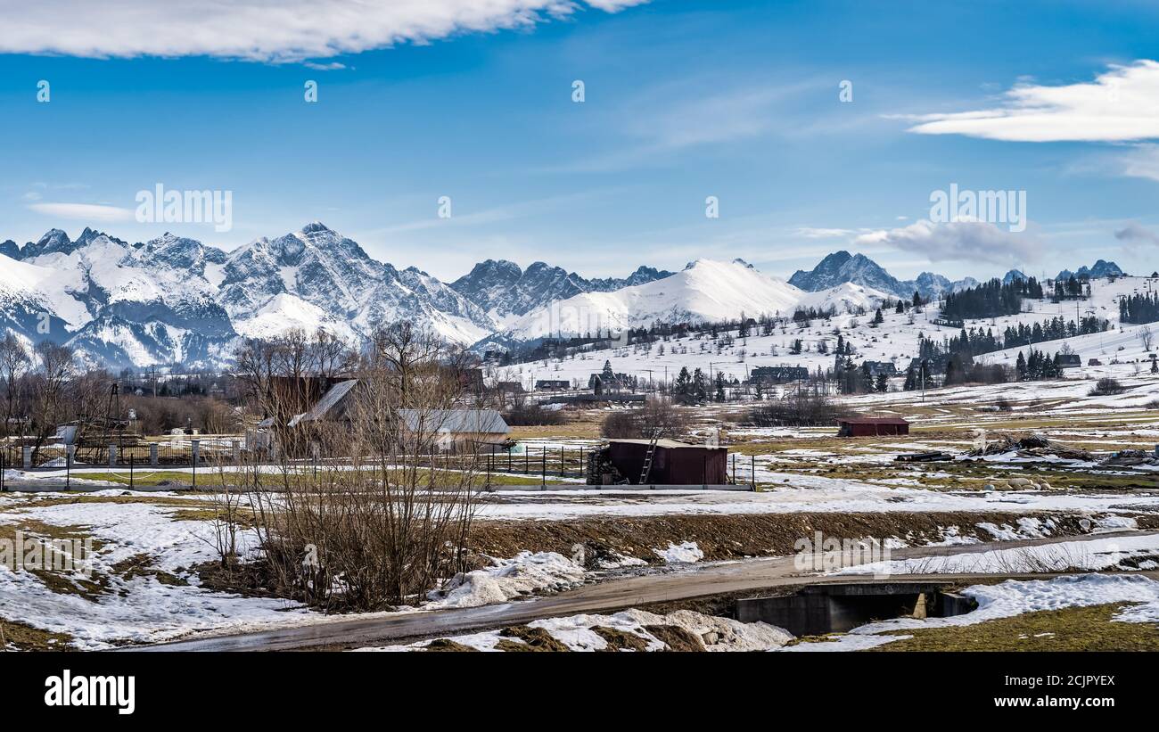 Panoramic view on Bialka Tatrzanska village in winter, with snowy Tatra ...