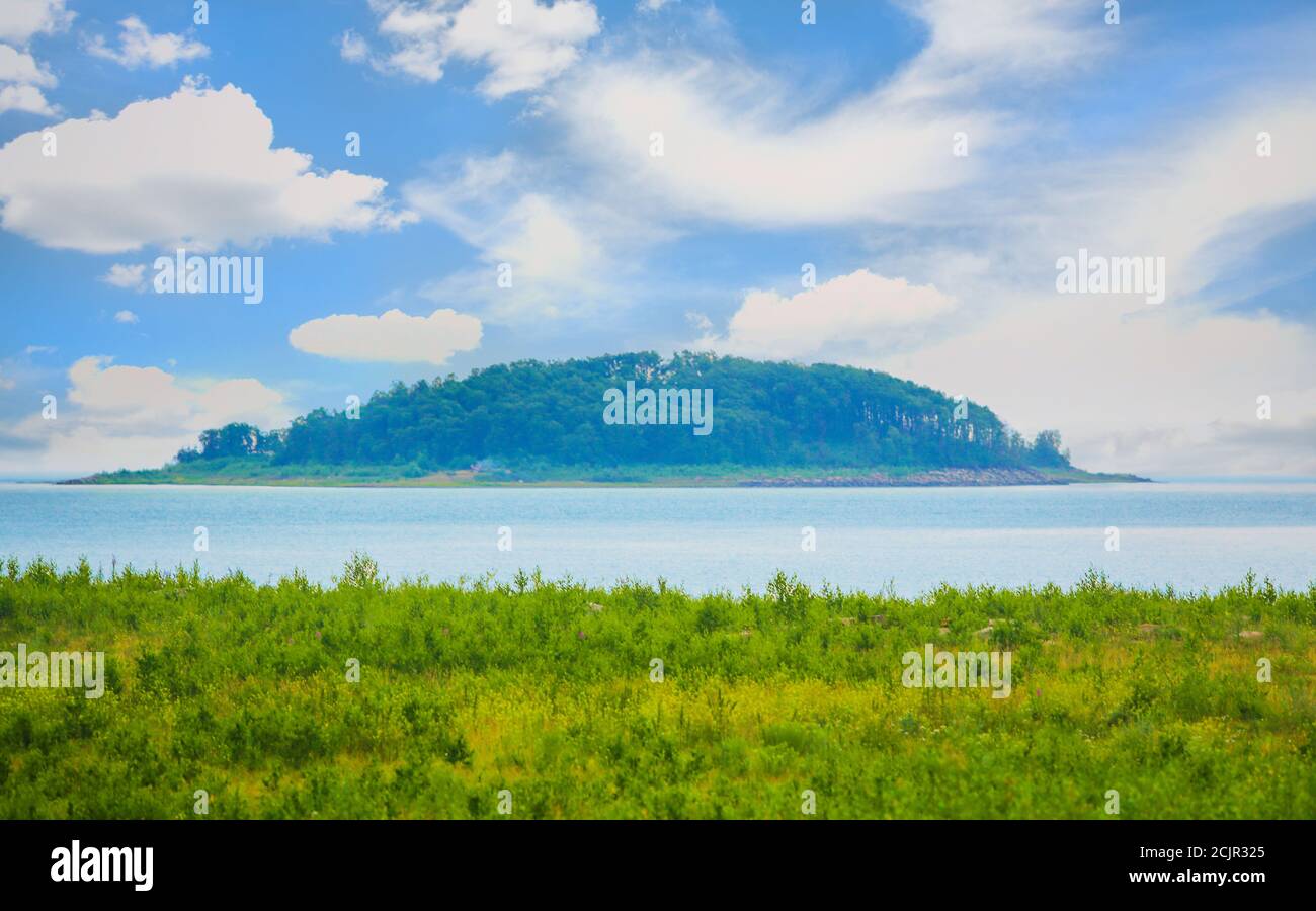 island overgrown with trees in center of lake Stock Photo - Alamy