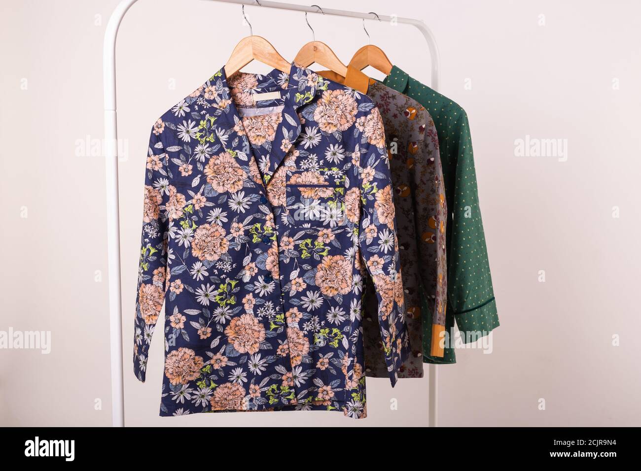 Clothing retails concept. Ladies pajamas on hangers in clothes store ...