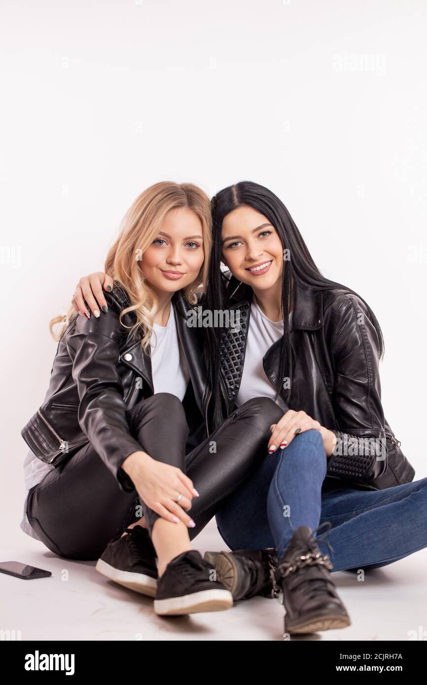 two cool students having solid friendship. close up full length photo ...