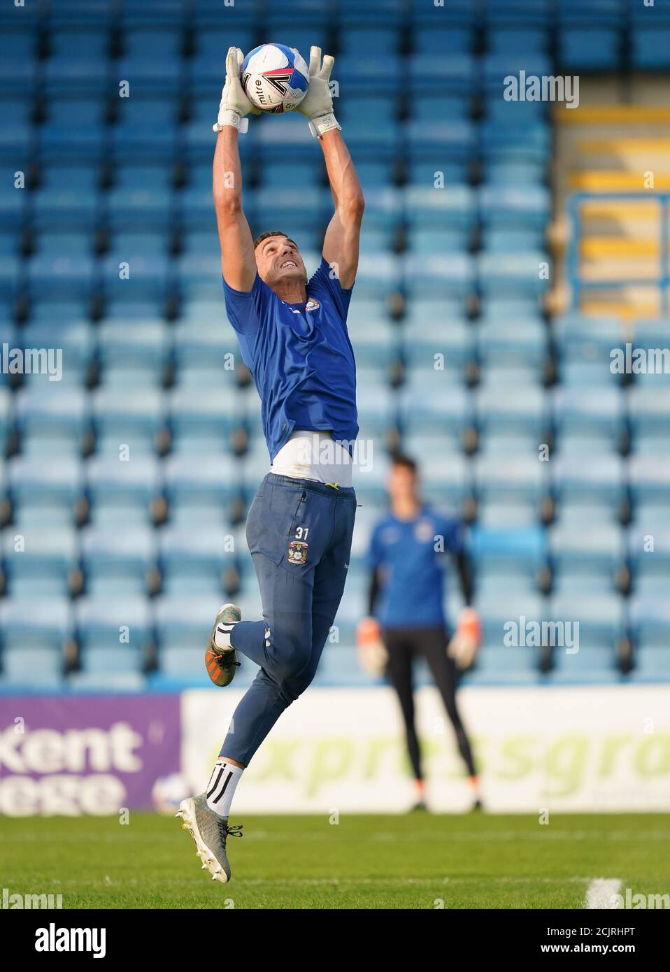 Coventry City goalkeeper Tom Billson warming up before the Carabao Cup ...