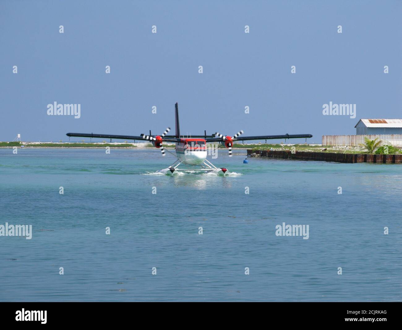 Maldivian Air Taxi plane taxis at the seaport section of Male Airport ...