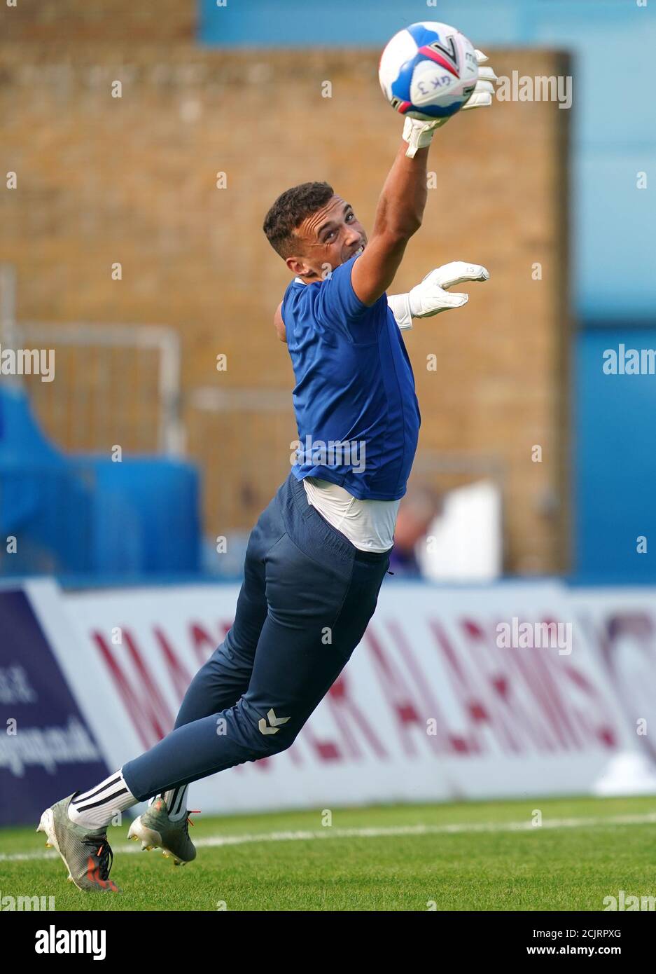 Coventry City goalkeeper Tom Billson warming up before the Carabao Cup ...