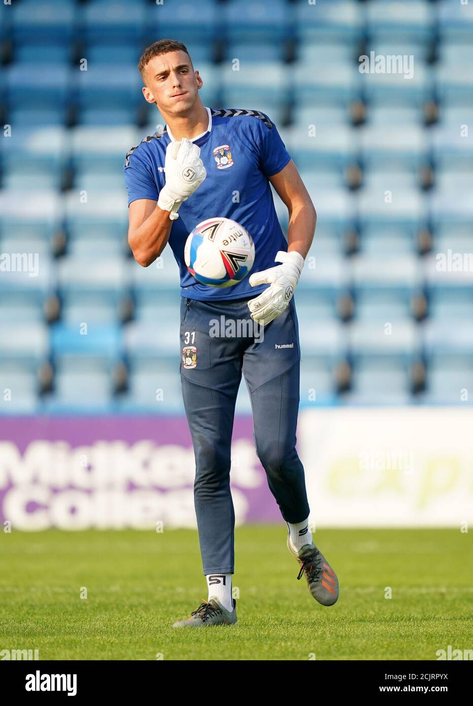 Coventry City goalkeeper Tom Billson warming up before the Carabao Cup ...
