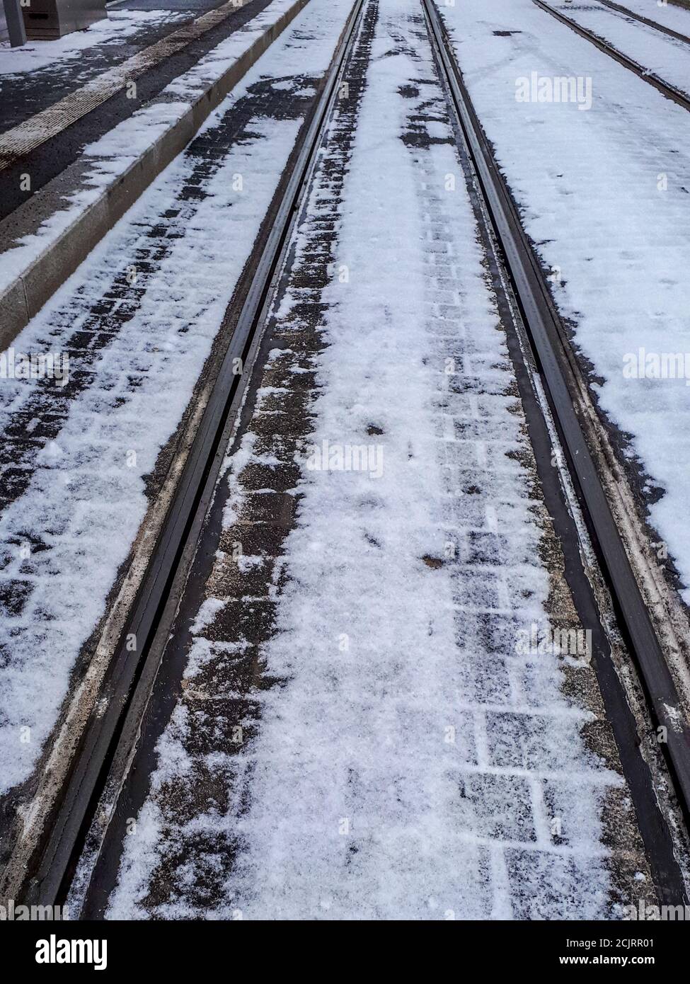 Vertical shot of a railway covered with snow during winter Stock Photo ...