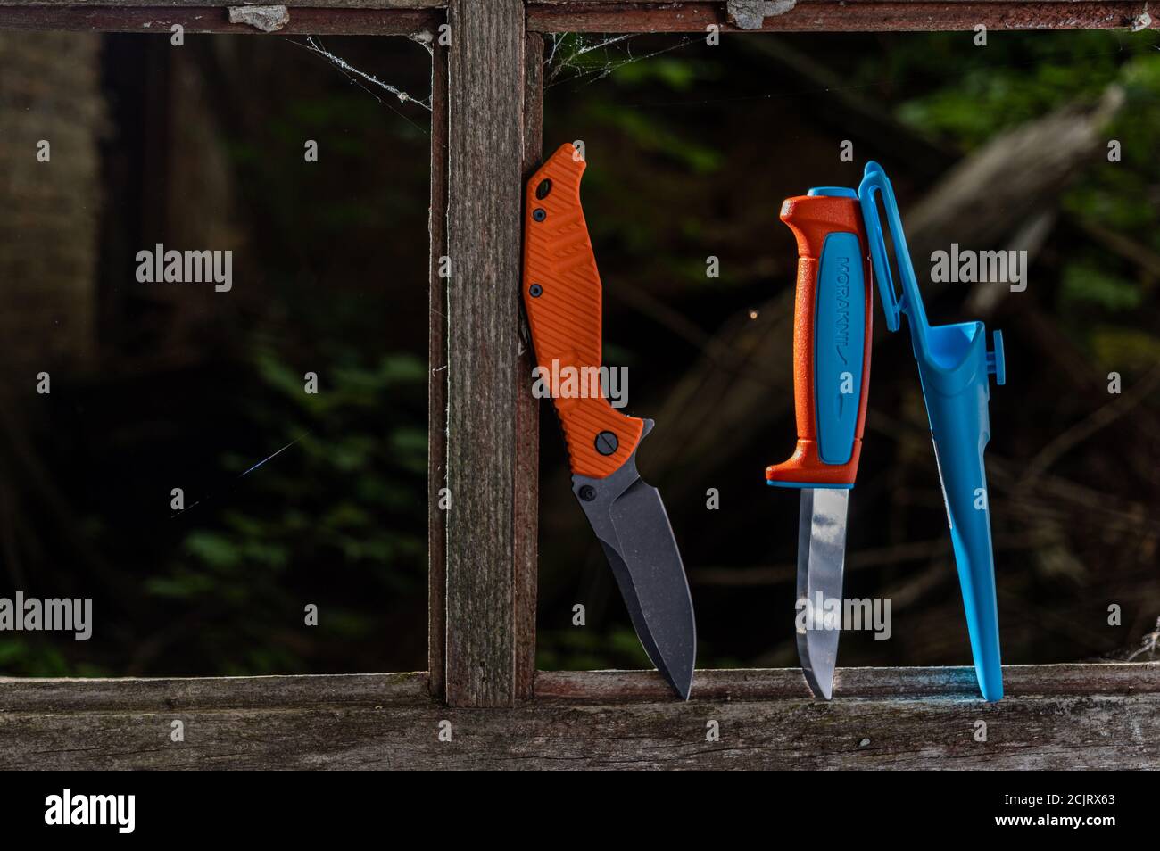 Various knives. Various knives in the window frame Stock Photo - Alamy