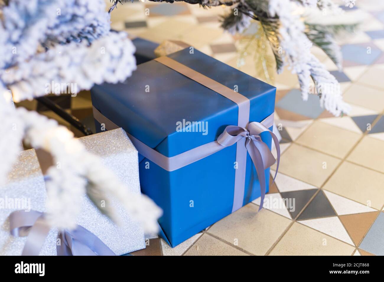 Wrapped gifts under a Christmas tree. Winter holidays concept Stock ...