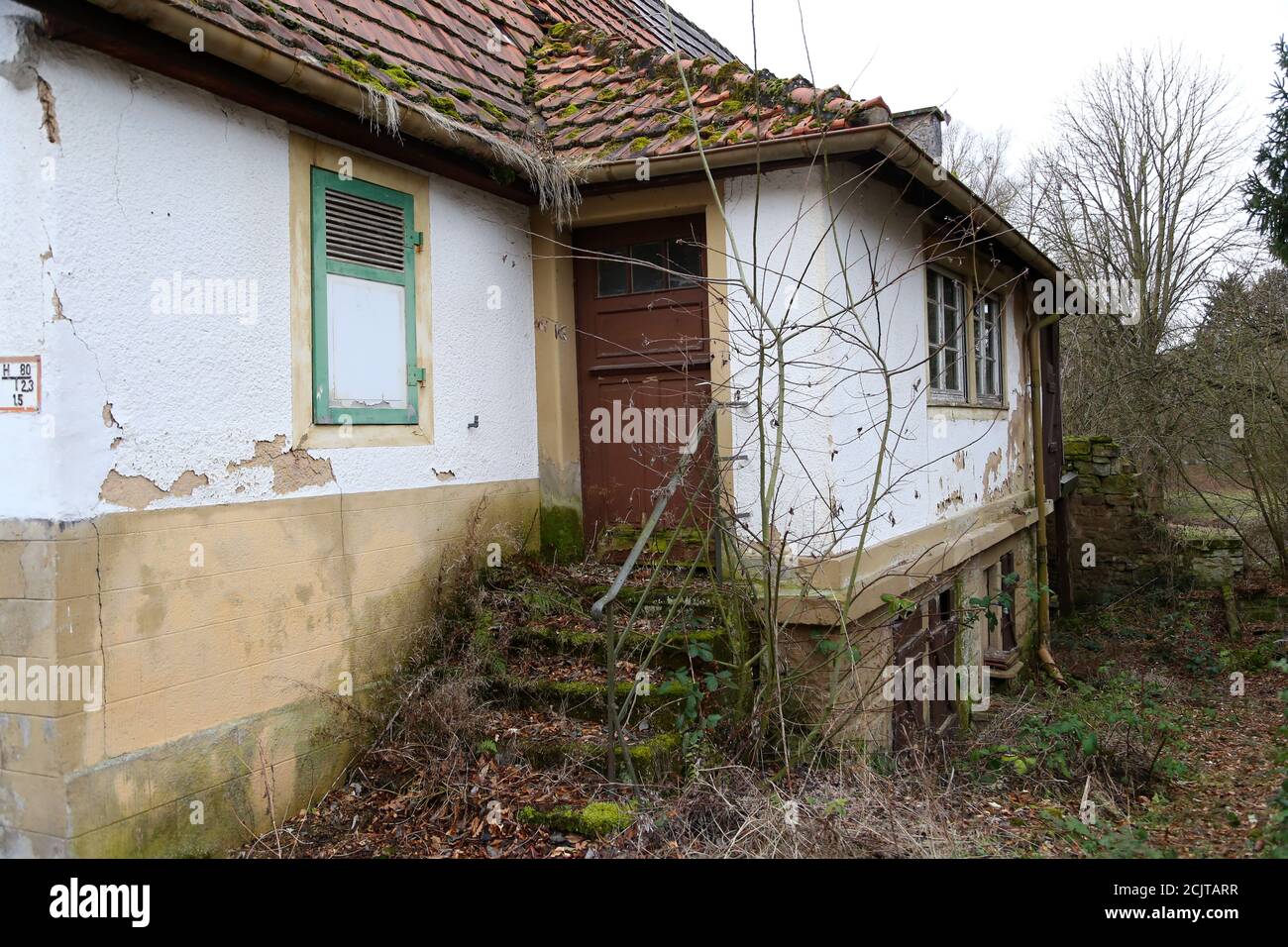 Grey scenery of an old house with wooden windows Stock Photo - Alamy