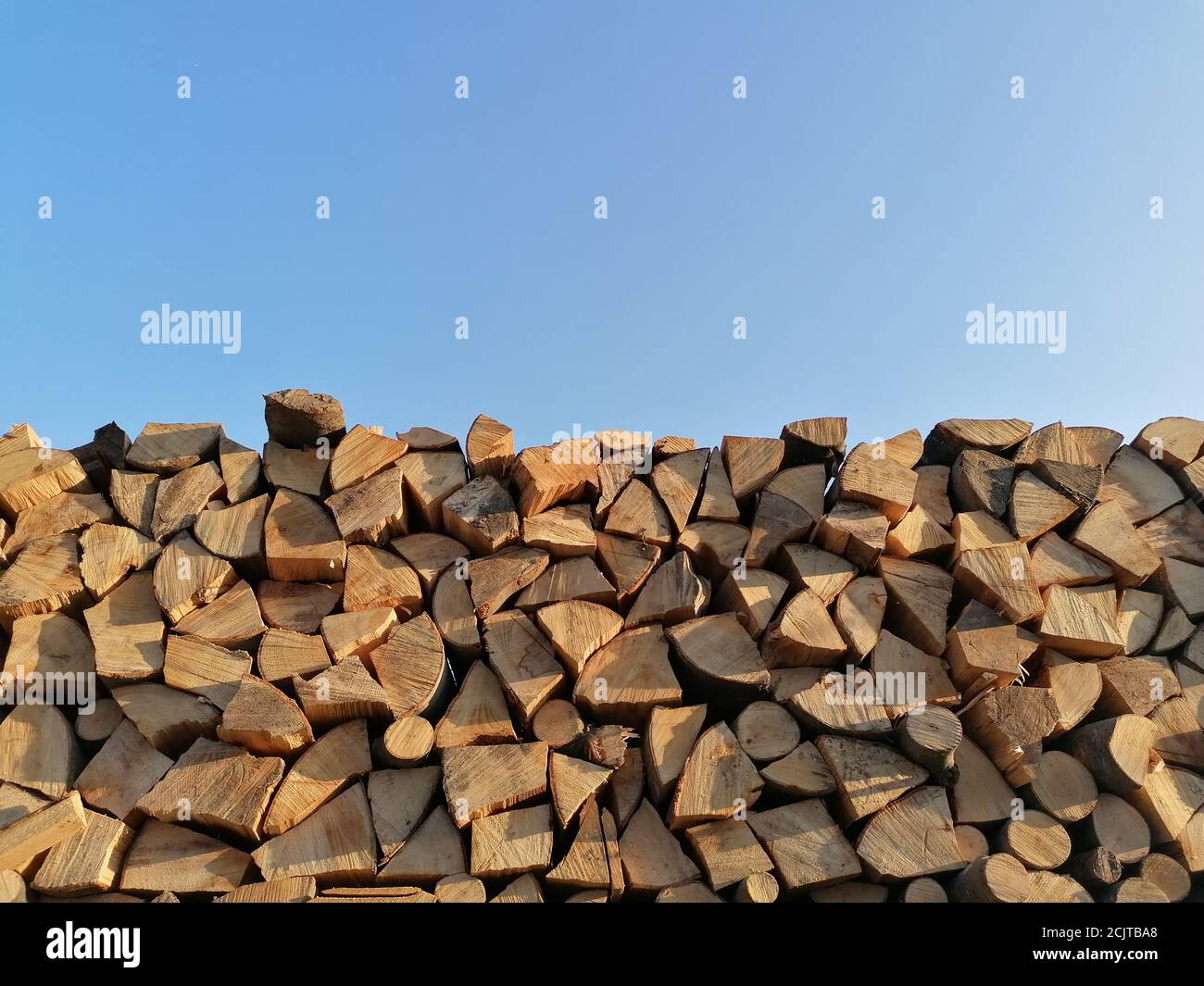 Pile of logs stacked on top of each other Stock Photo - Alamy