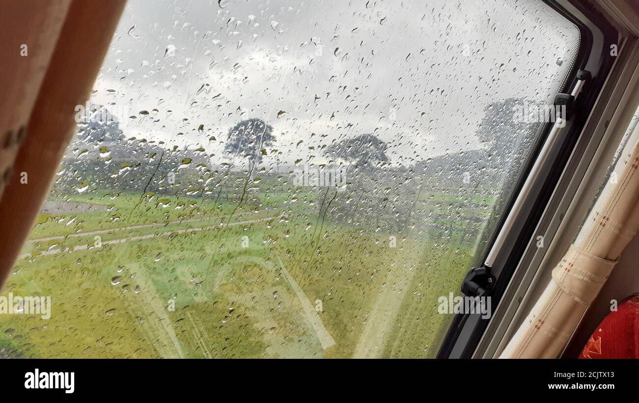 Rain on a caravan window Stock Photo - Alamy