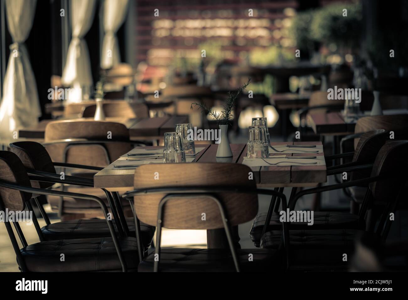 Restaurant table set up for diners. Romantic late evening fine dining ...