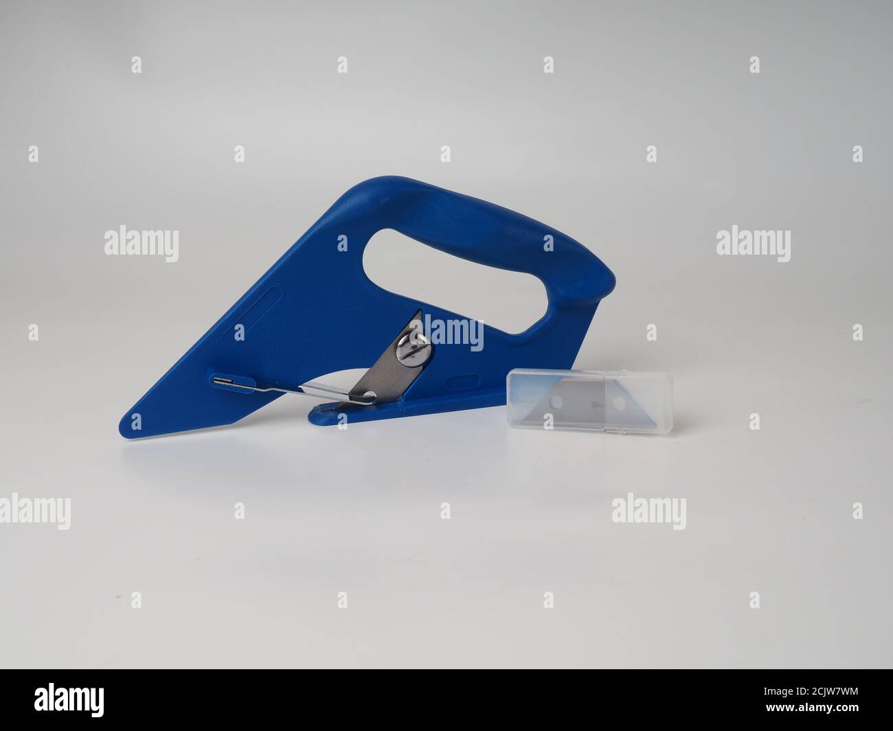 blue carpet cutter, tool isolated on white background Stock Photo - Alamy