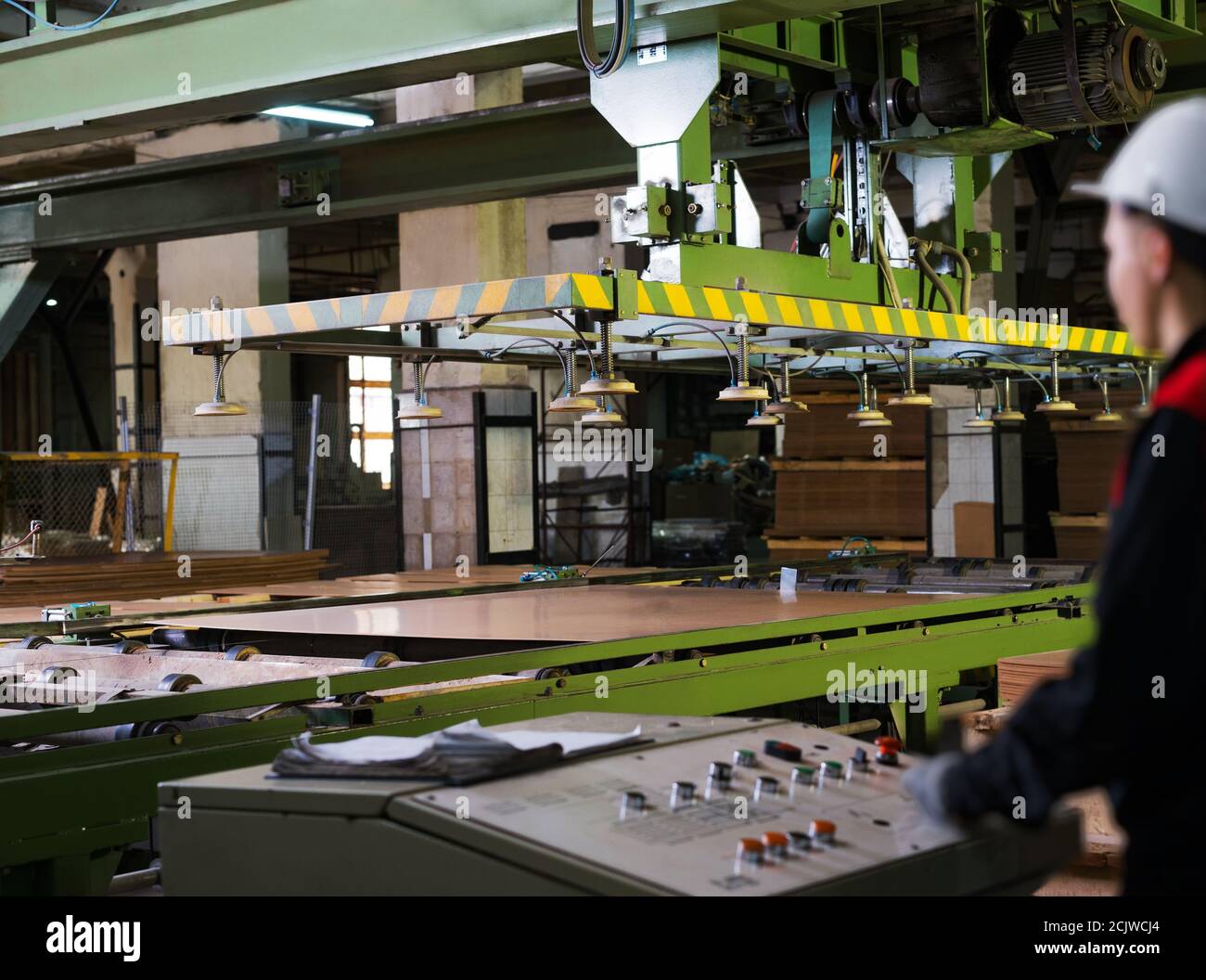 Operator at control panel in production plant Stock Photo - Alamy