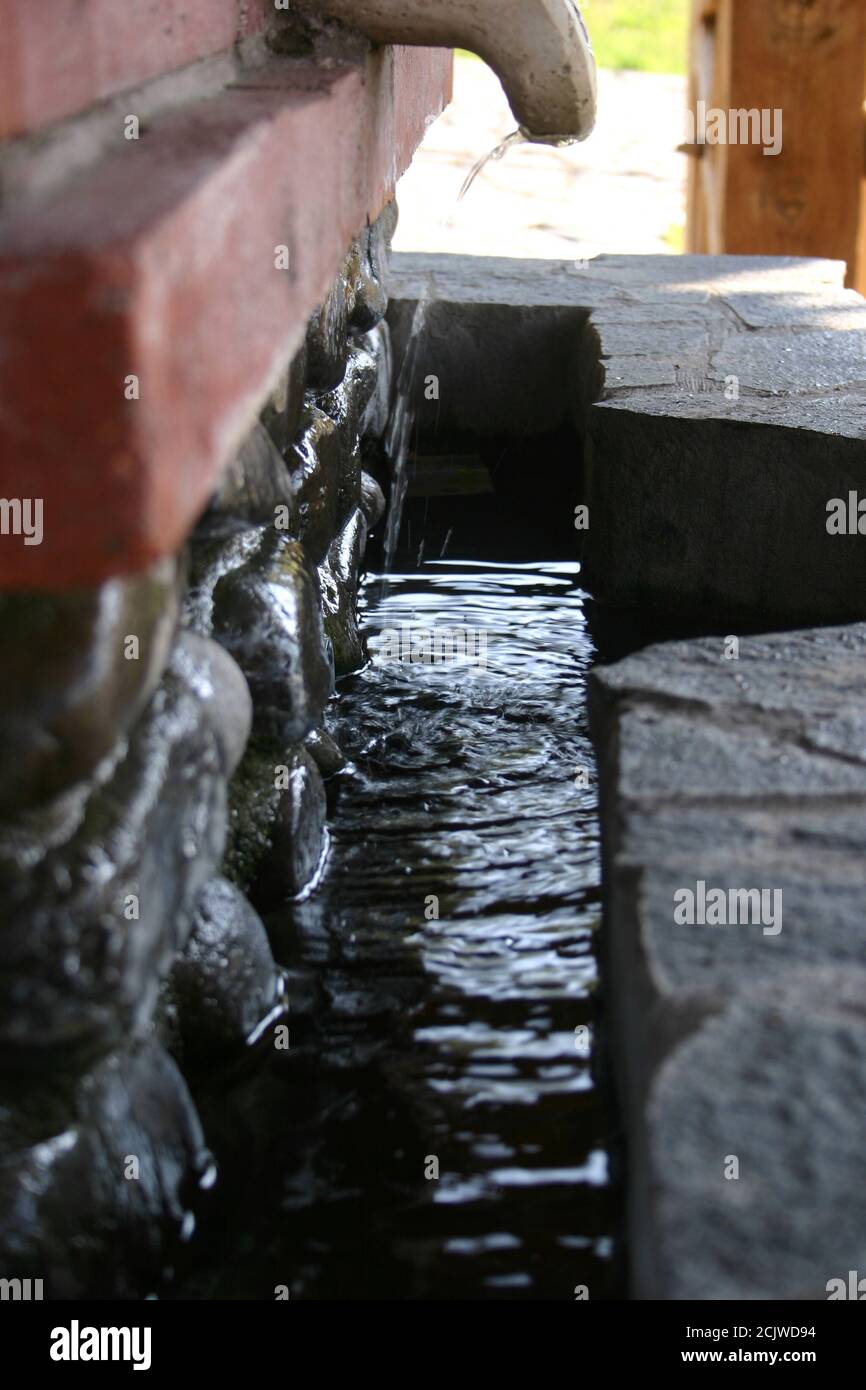 Water dripping from a water source Stock Photo - Alamy