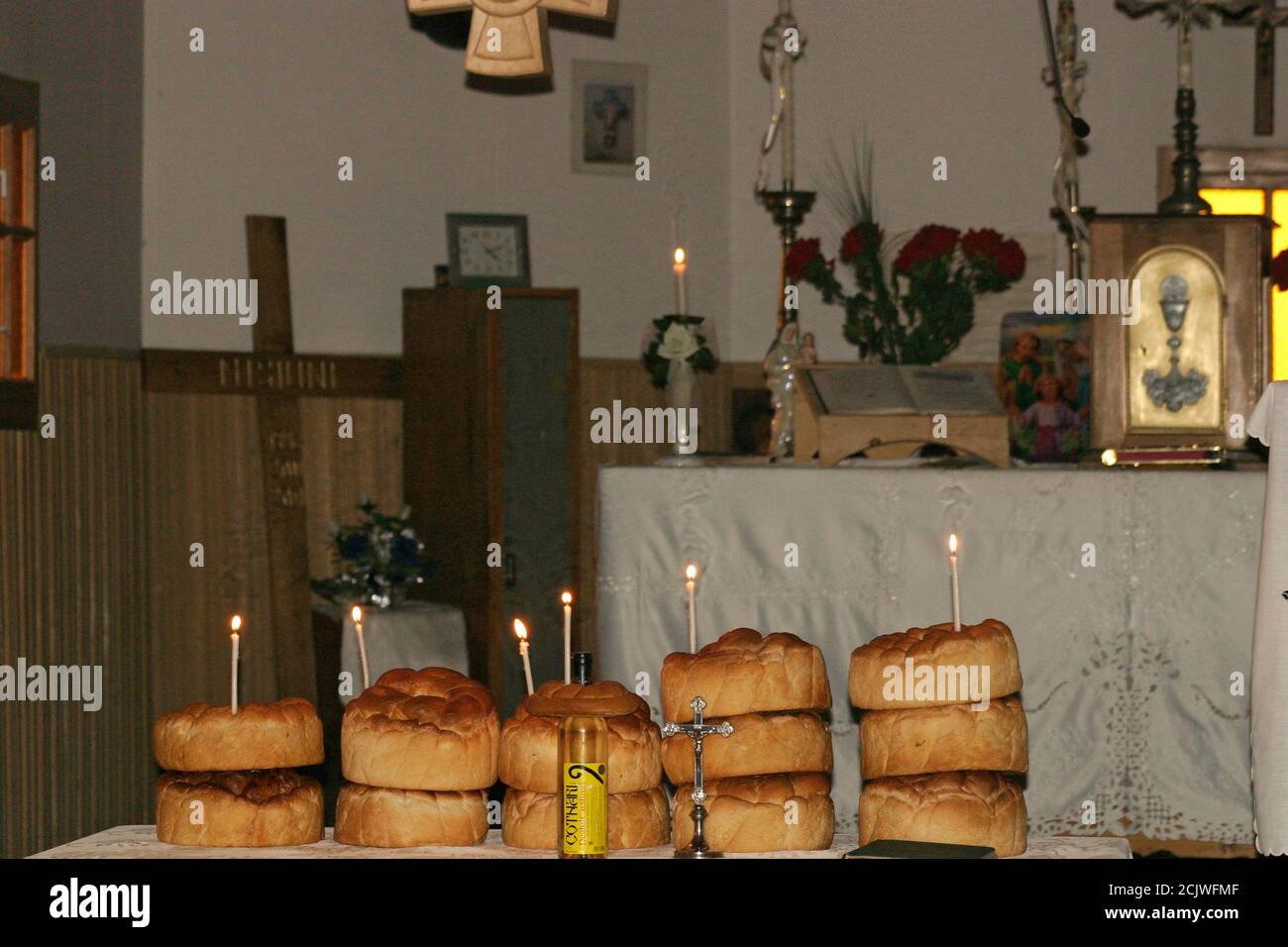 Prosphora (Holy Bread) with lit-up candles during a Divine Liturgy in a ...
