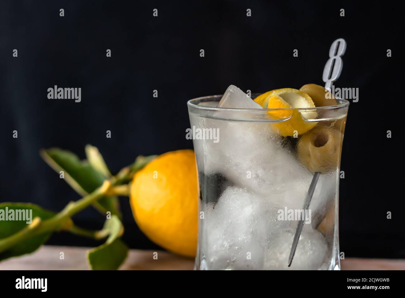 Closeup shot of an iced martini cocktail with olives and lemon Stock ...