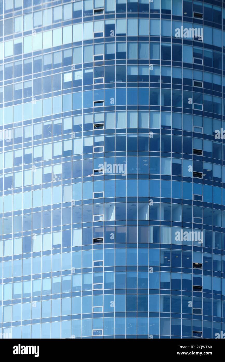 Facade of a glass building as a background. Vertically Stock Photo - Alamy