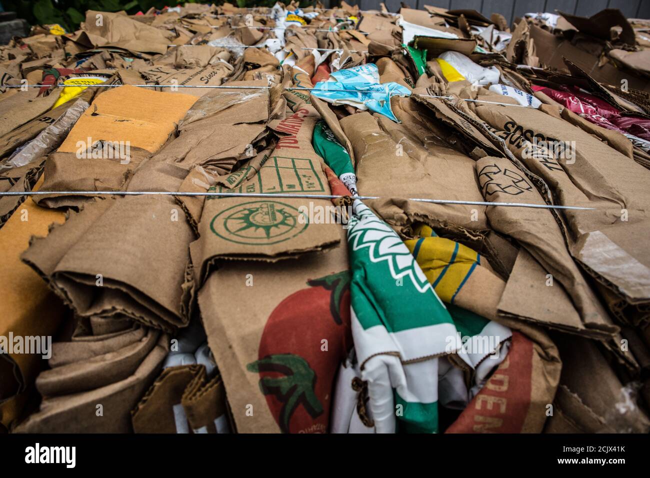 Crushed cardboard boxes, wrapped and ready for recycling Stock Photo ...