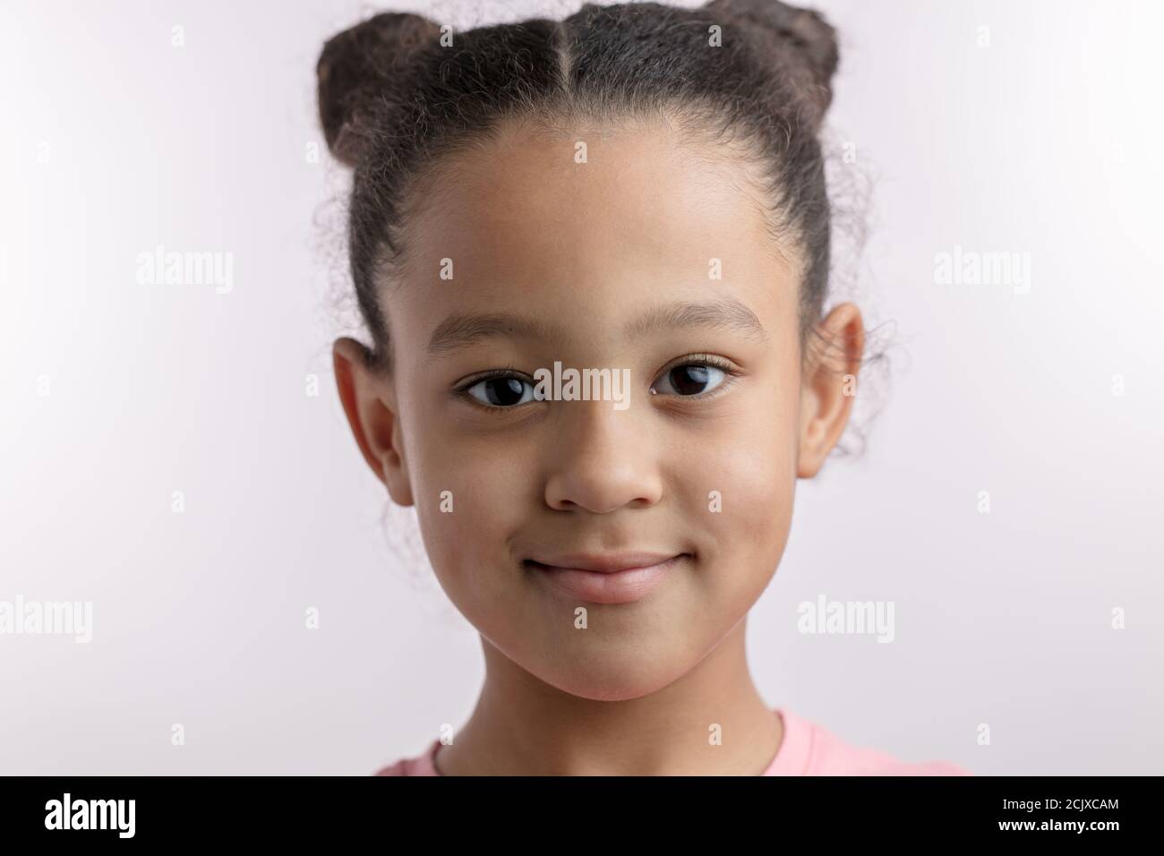 beautiful mulatto girl with wavy black hair in good mood. close up ...