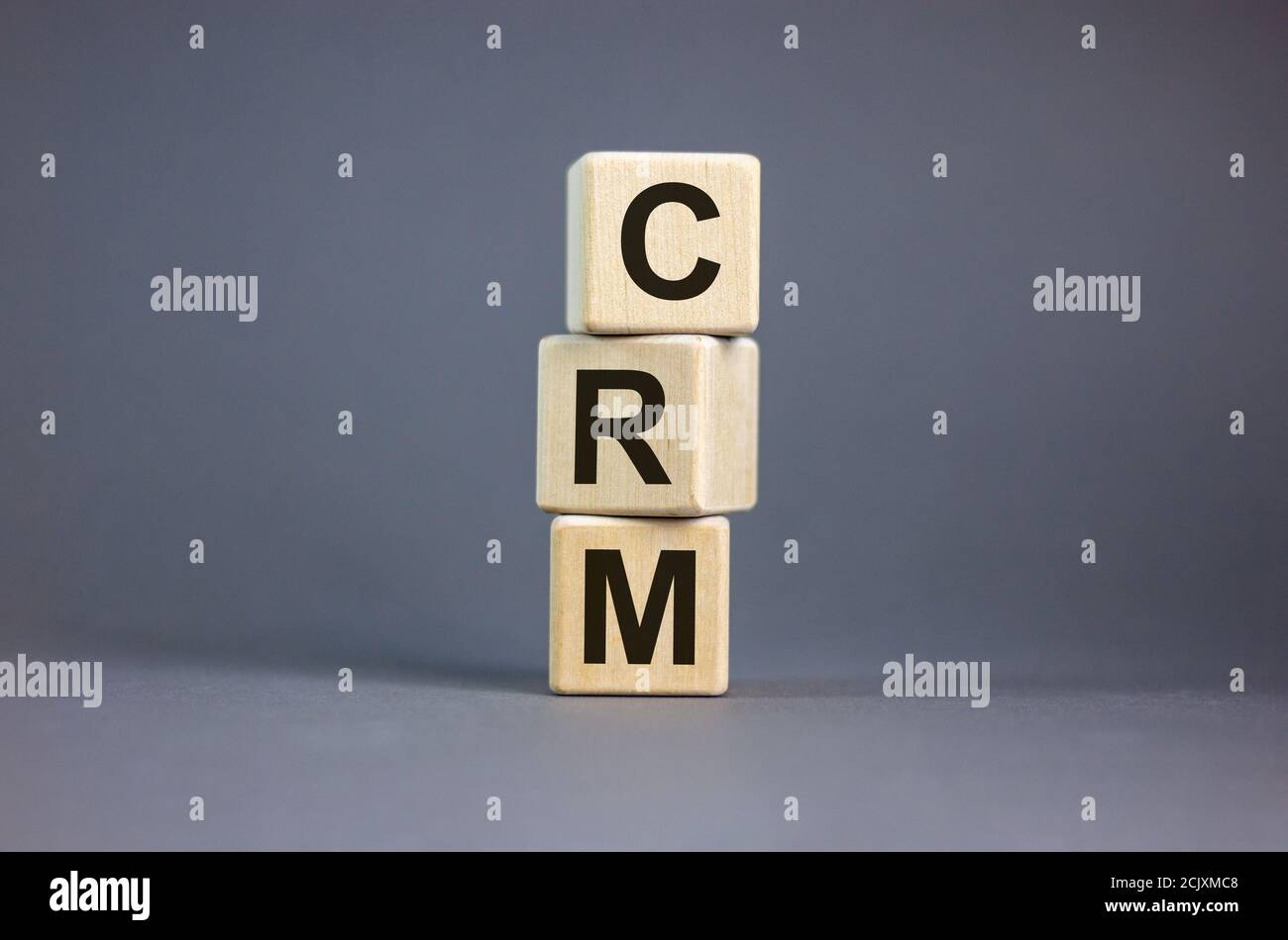 Concept words 'CRM, customer relationship management' on cubes on a ...
