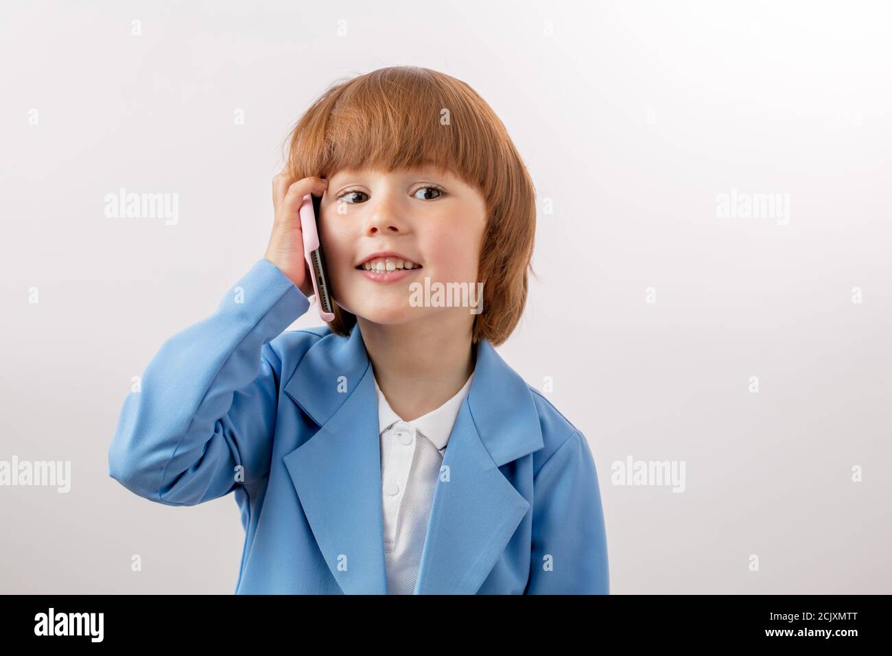 a handsome ginger boy is talking on the phone Stock Photo - Alamy