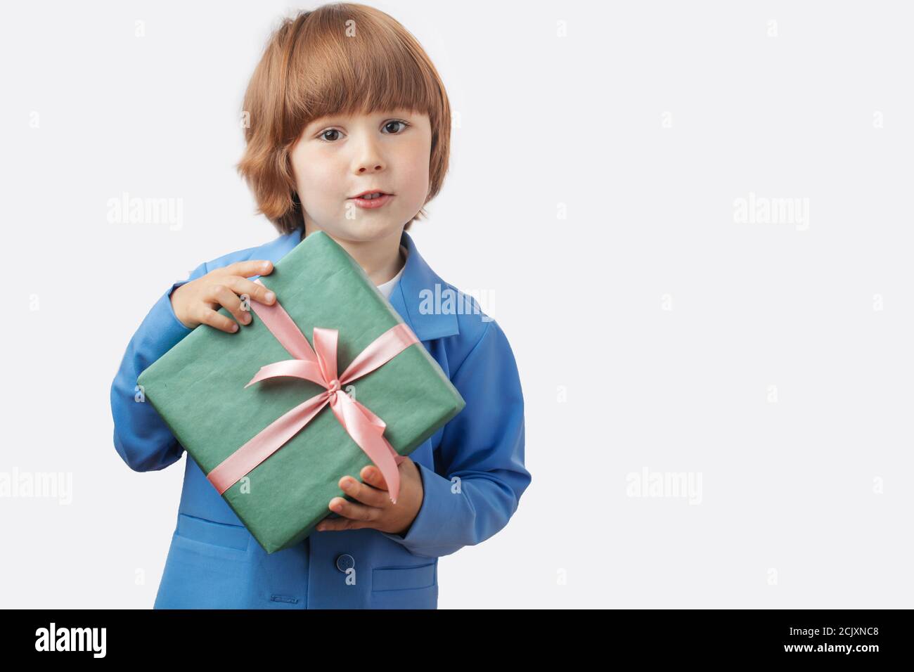 happy ginger boy with a box gift. celebration and holiday concept Stock ...