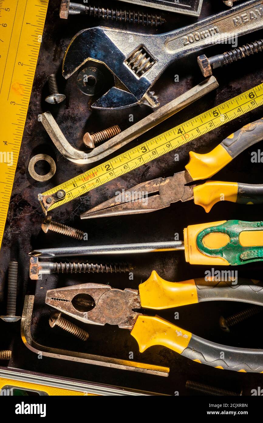 Set of manual tools on a metallic background Stock Photo - Alamy