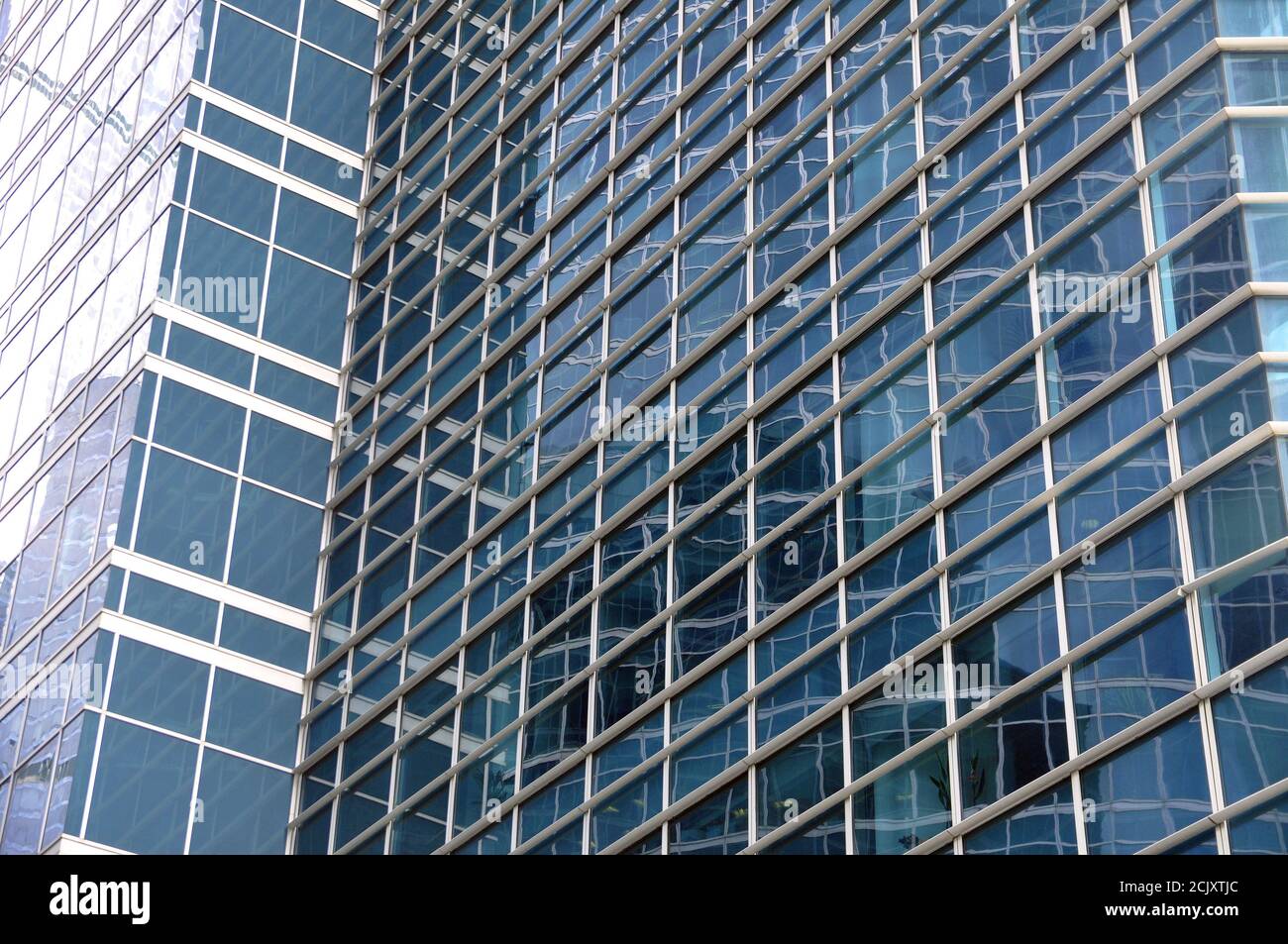 Skyscraper facade with glass facade and reflections Stock Photo - Alamy