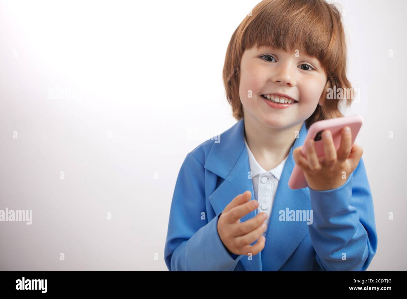 gift for a good behavior. smiling boy is beeing presented a new modern ...