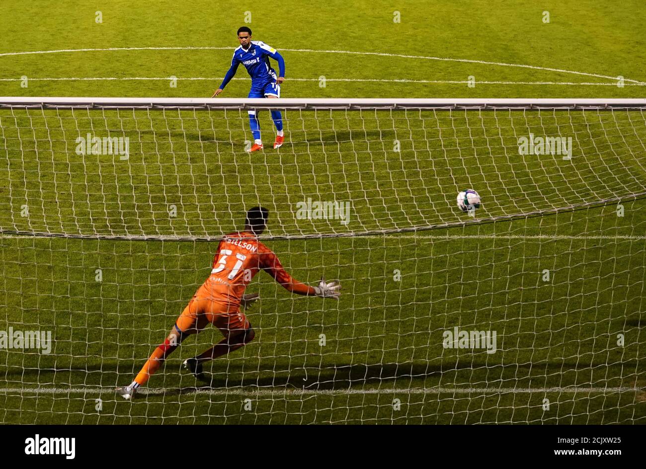 Gillingham's Trae Coyle scores his side's winning penalty in the shoot ...
