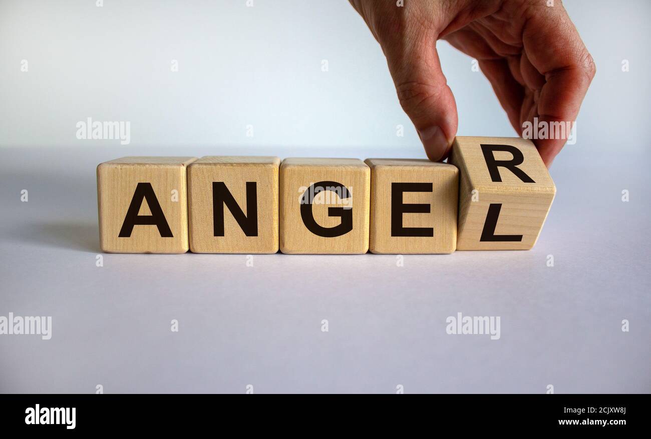 Having anger or being an angel. Hand turns a cube and changes the word ...