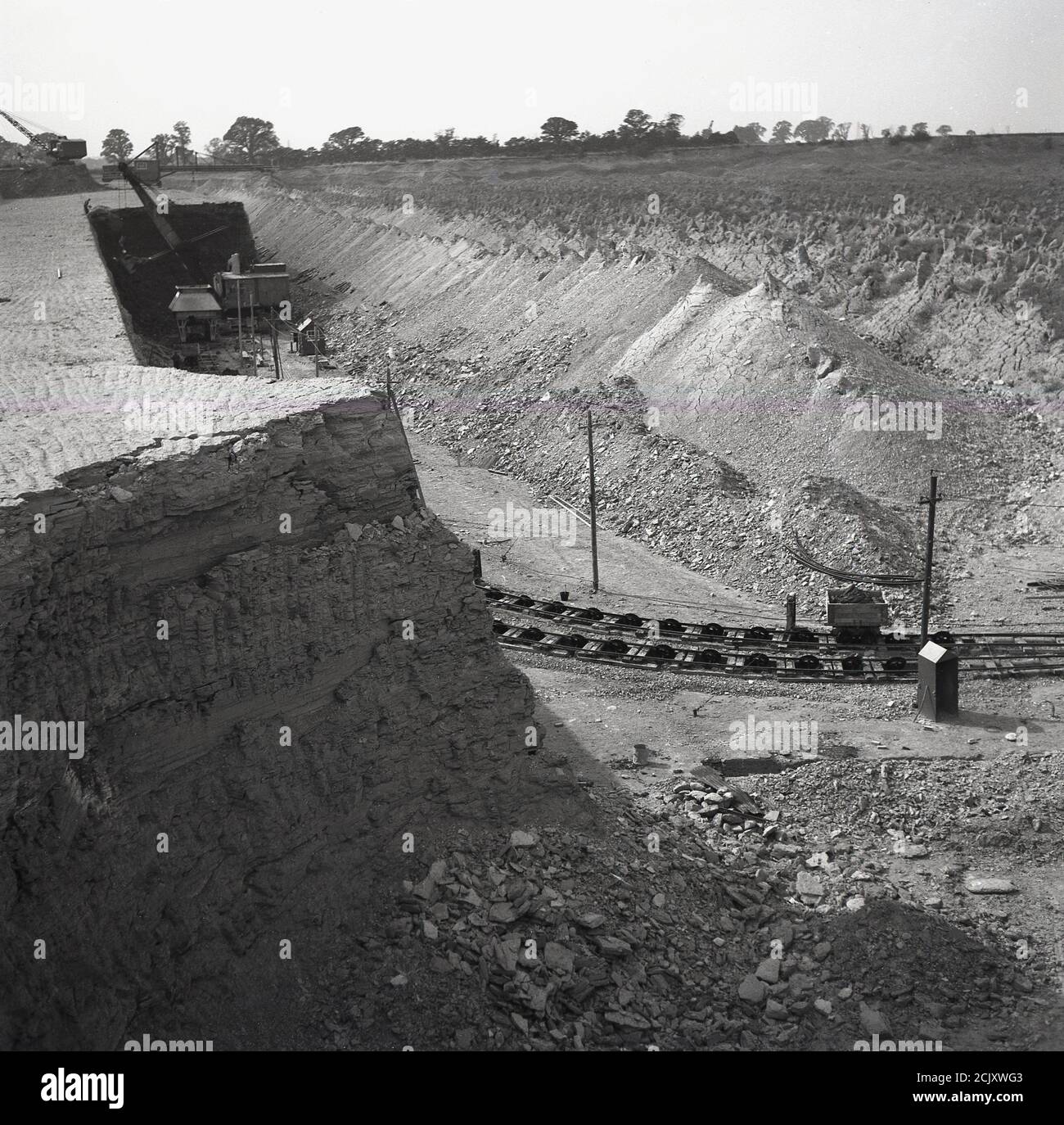 1950s, historical picture showing a large clay pit at a brickworks ...