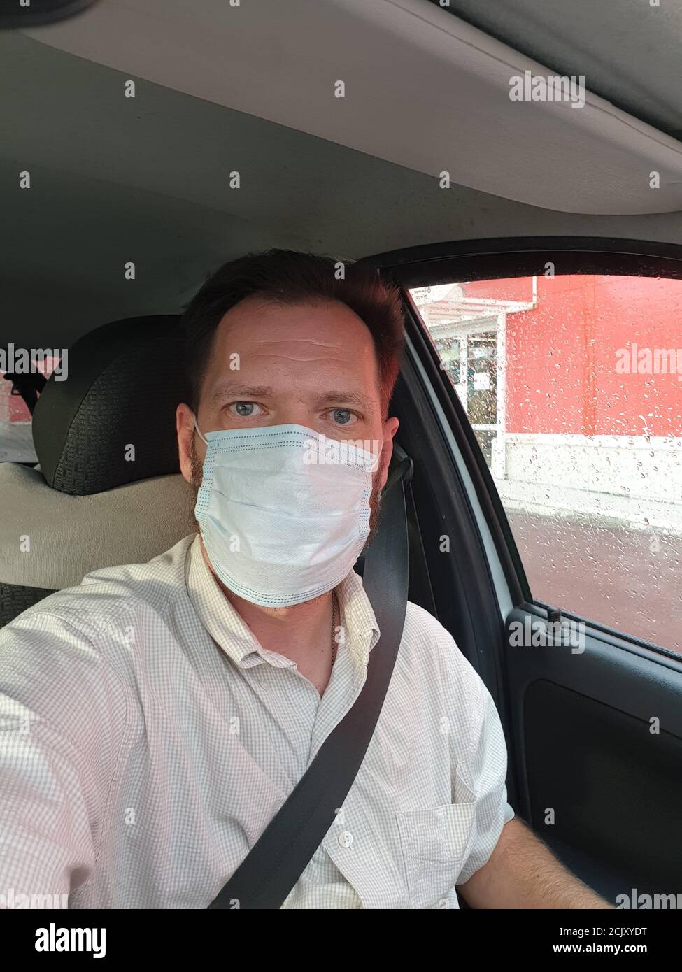 Woman in car driving doctor hi-res stock photography and images - Alamy