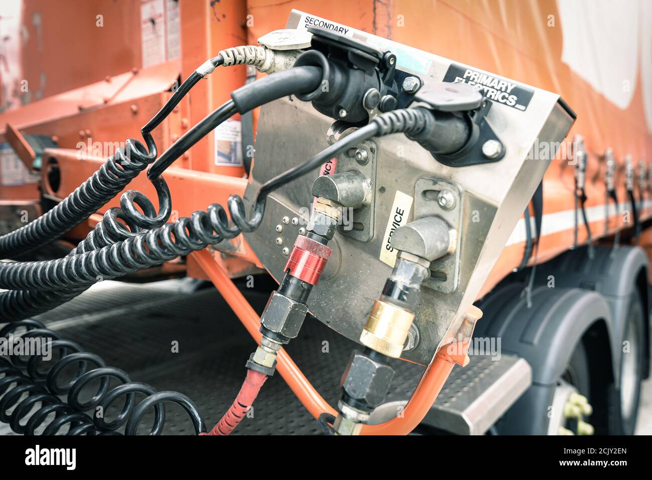 Back wall of a industrial tractor cab with high-pressure connecting ...