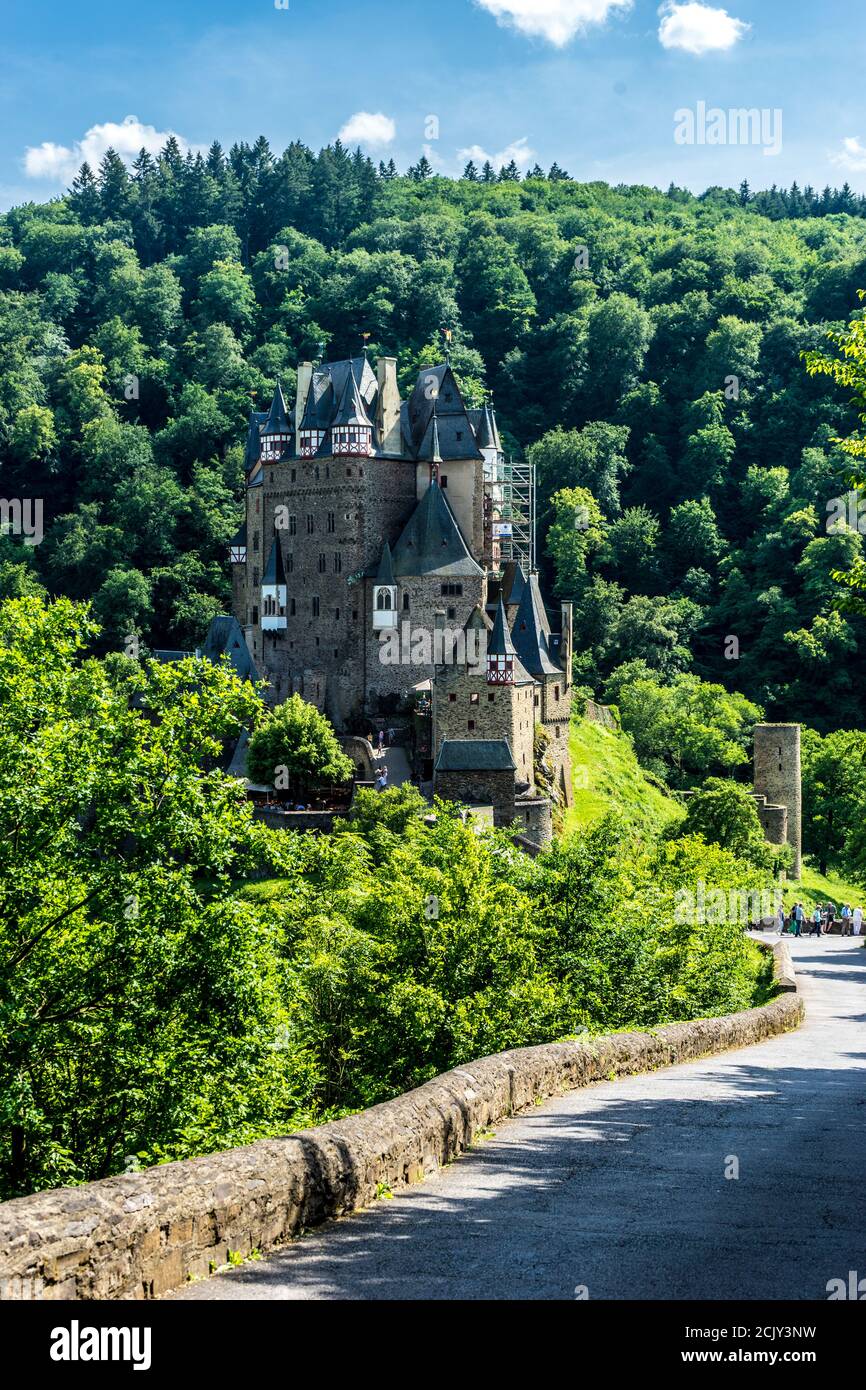 Beautiful vertical shot of the Eltz Castle surrounded by trees in ...